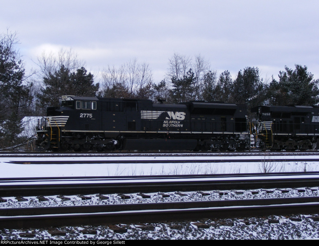 NS 2775 powers a mixed freight west.
